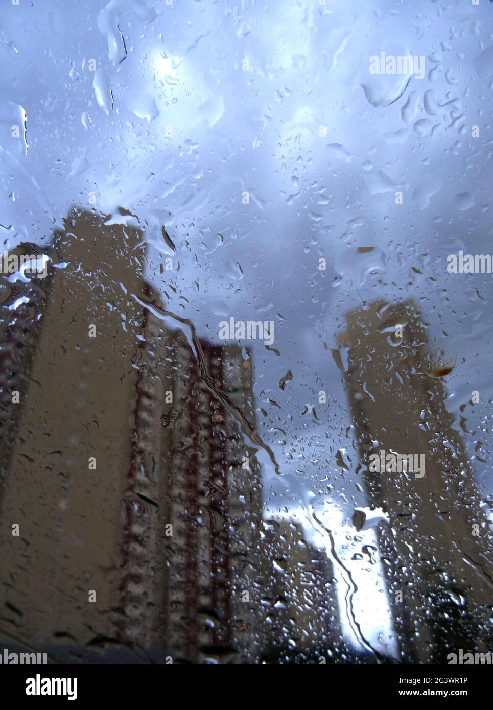 City street in rain through hi-res stock photography and images - Alamy