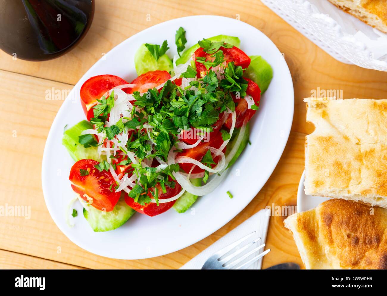 Plate with vegetable salad with tomatoes and cucumber Stock Photo - Alamy