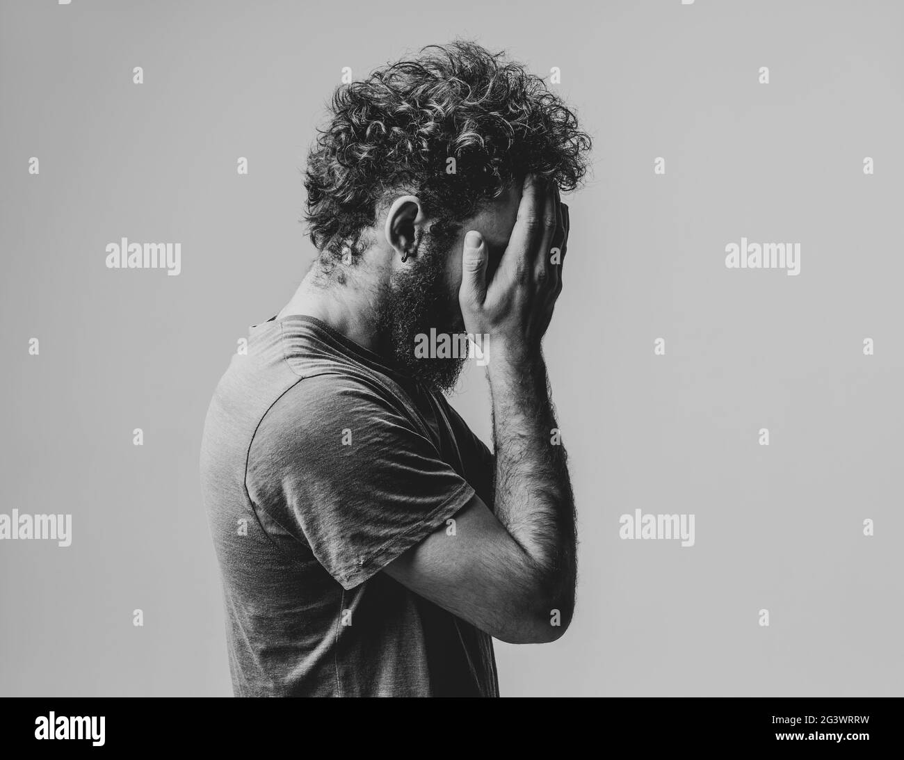 Drama, crisis, tired exhausted man cover face with his hands. Lost face ...