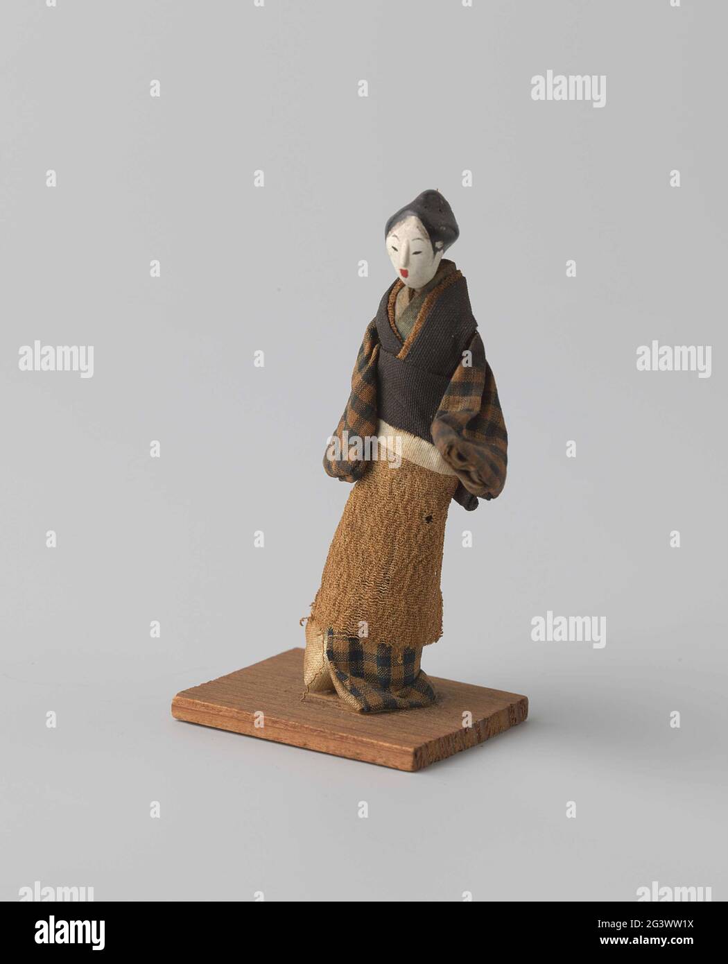 Pop of wood in Japanese clothing. Puppet made of wood in Japanese ...
