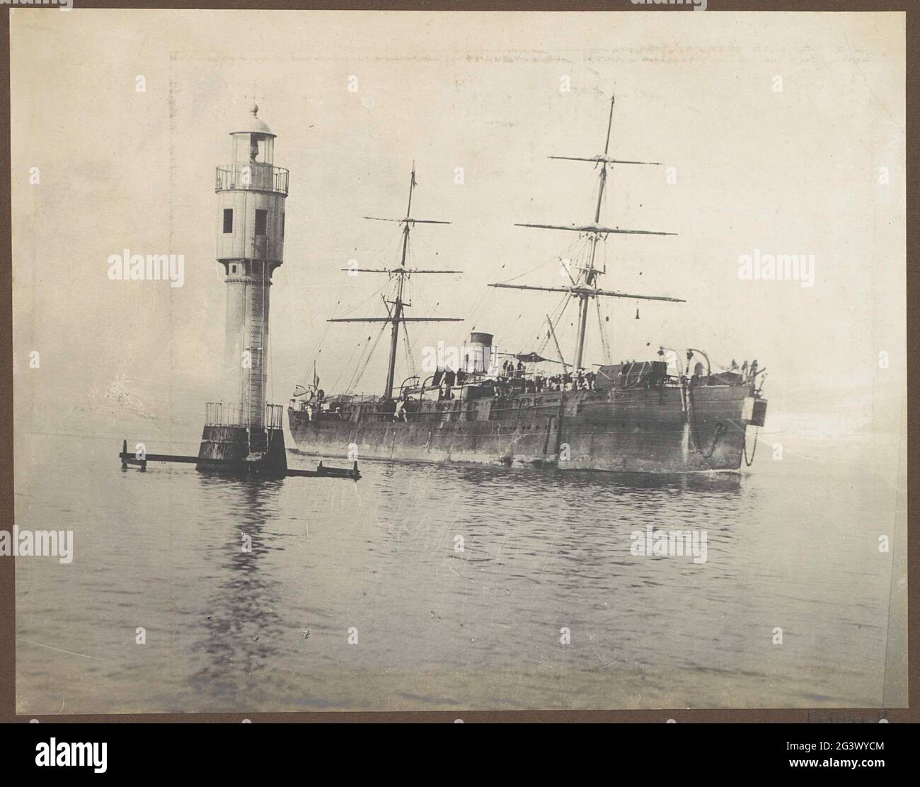 Ship passes a lighthouse, presumably at the Suez Canal. Part of travel ...