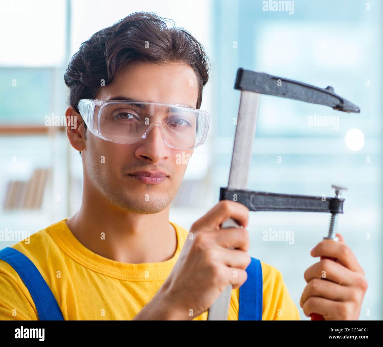 Furniture carpenter working in the workshop Stock Photo - Alamy
