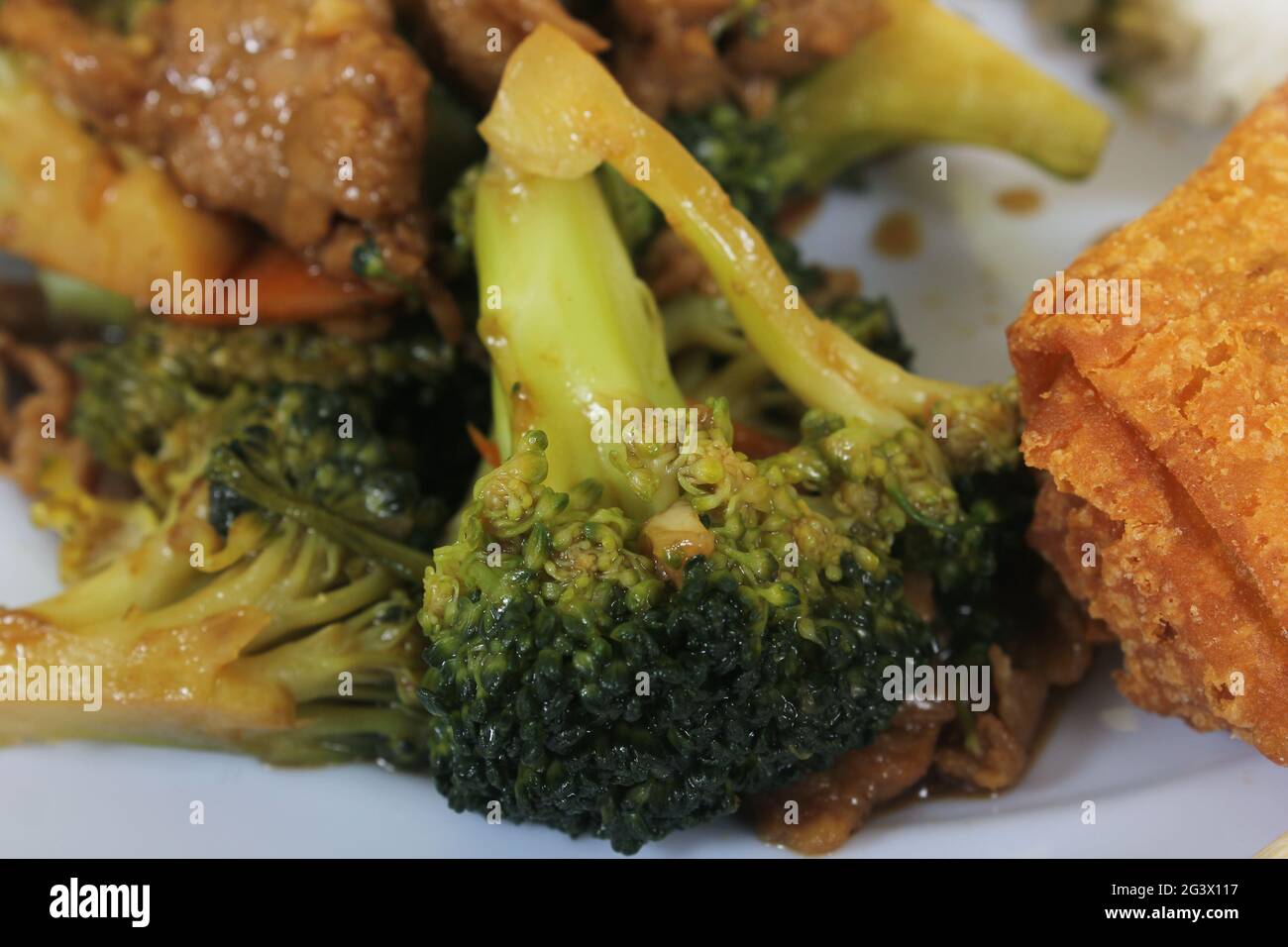 Beef Broccoli and Egg Roll on Plate at Chinese Restaurant Stock Photo ...