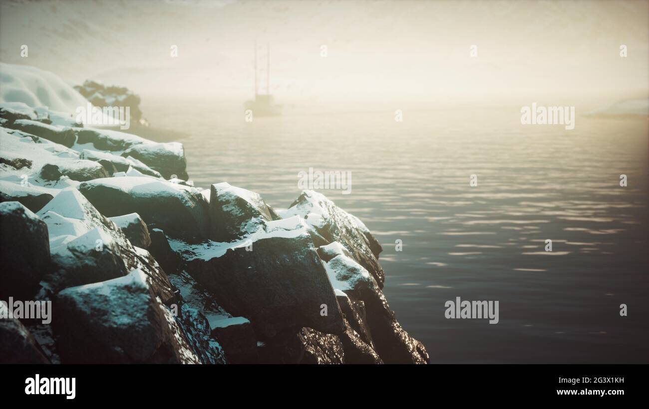 Snow covered mountains in northern ocean Stock Photo - Alamy