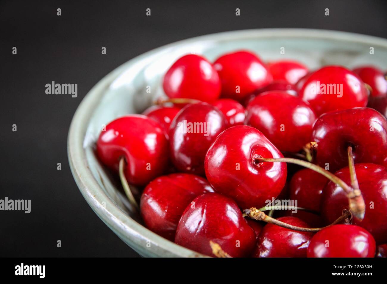 Fresh cherries in a bowl Stock Photo - Alamy