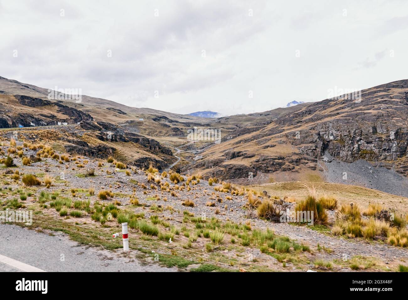 View of arid mountains, wonderful cloudy landscape with dry grasses in ...