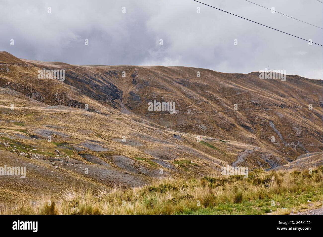 View of arid mountains, wonderful cloudy landscape with dry grasses in ...