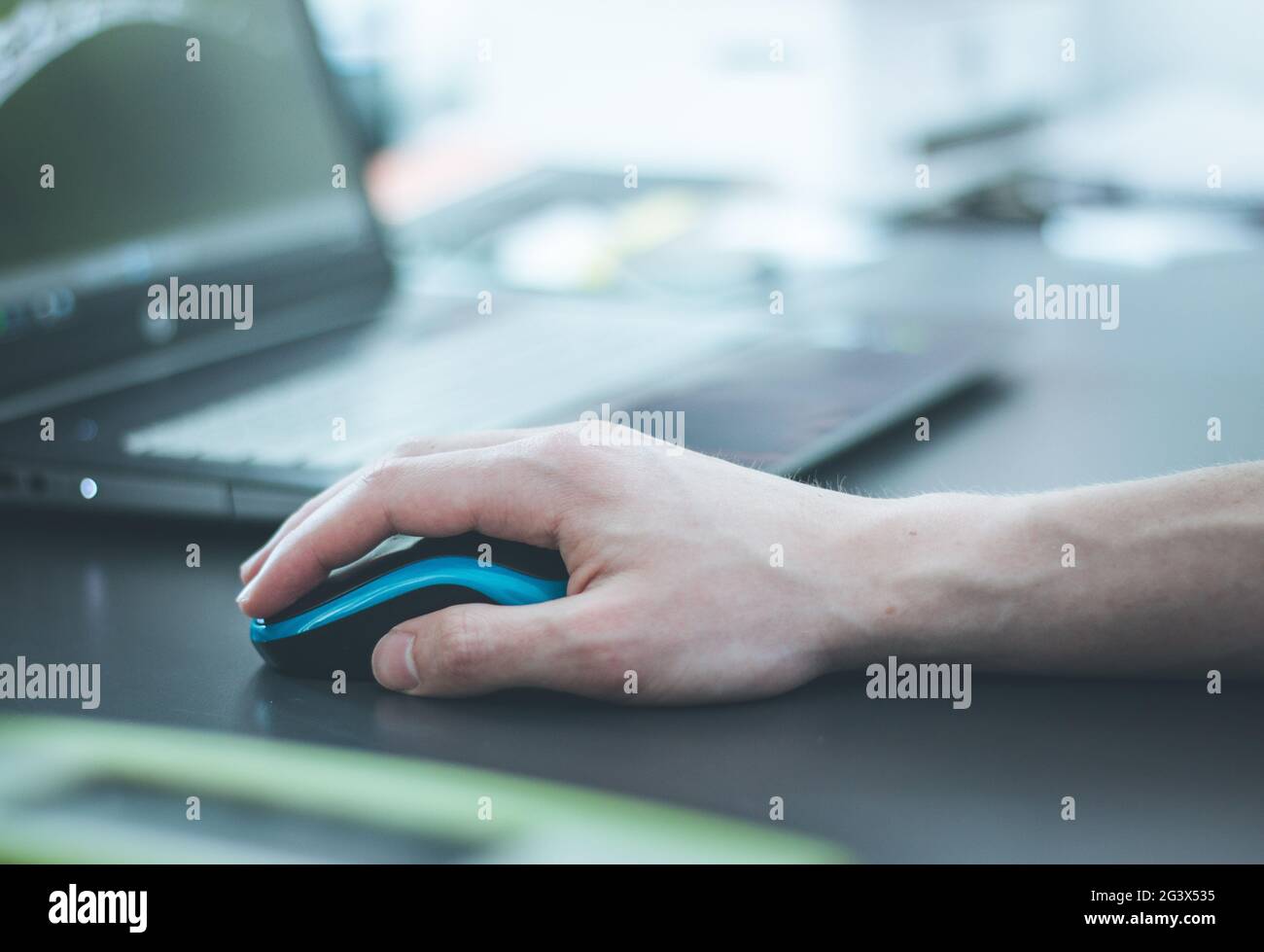 Computer input concept: Computer mouse and male hand Stock Photo - Alamy