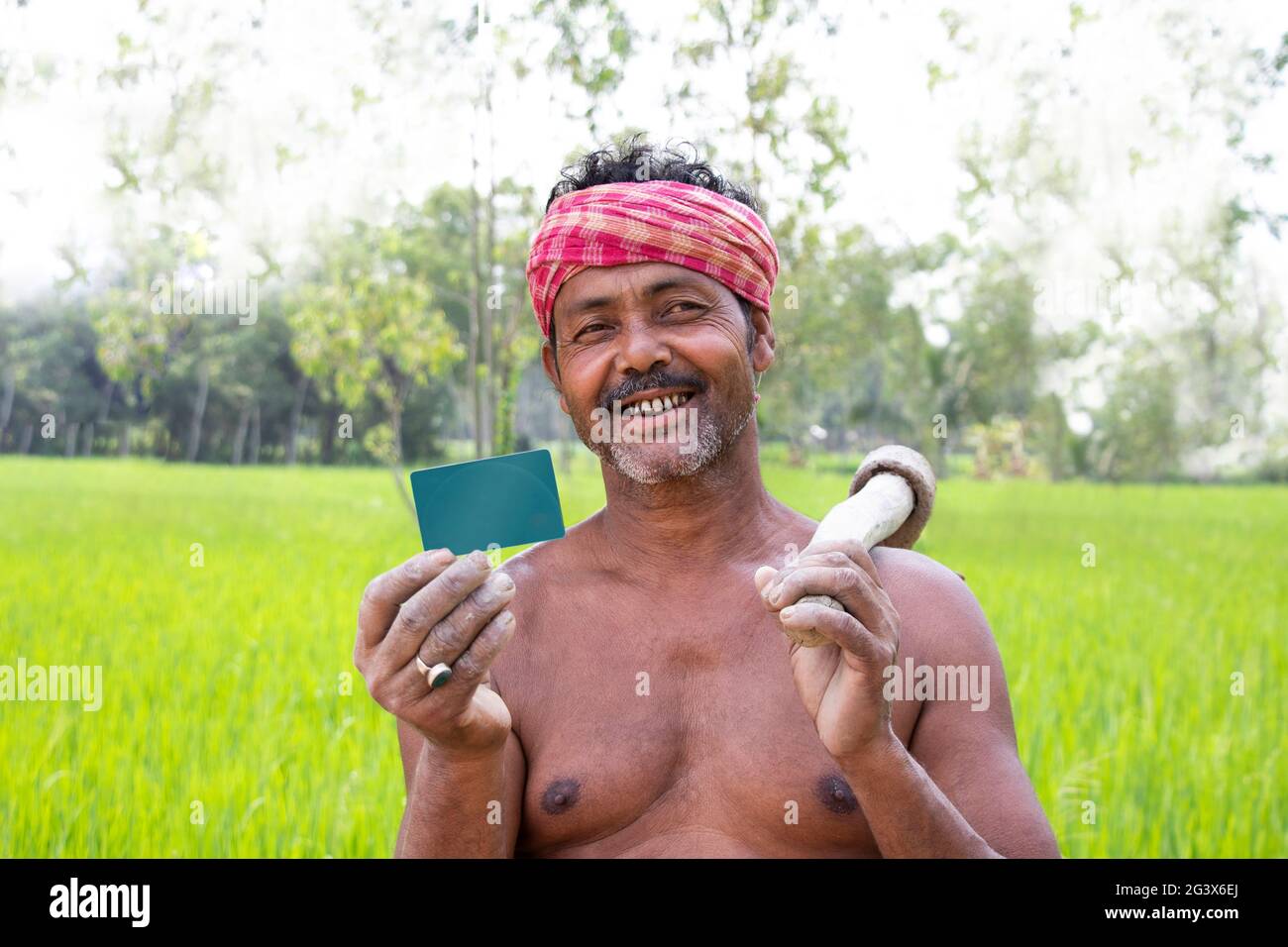 Rural Indian Farmer Showing Business card in agricultural field Stock ...