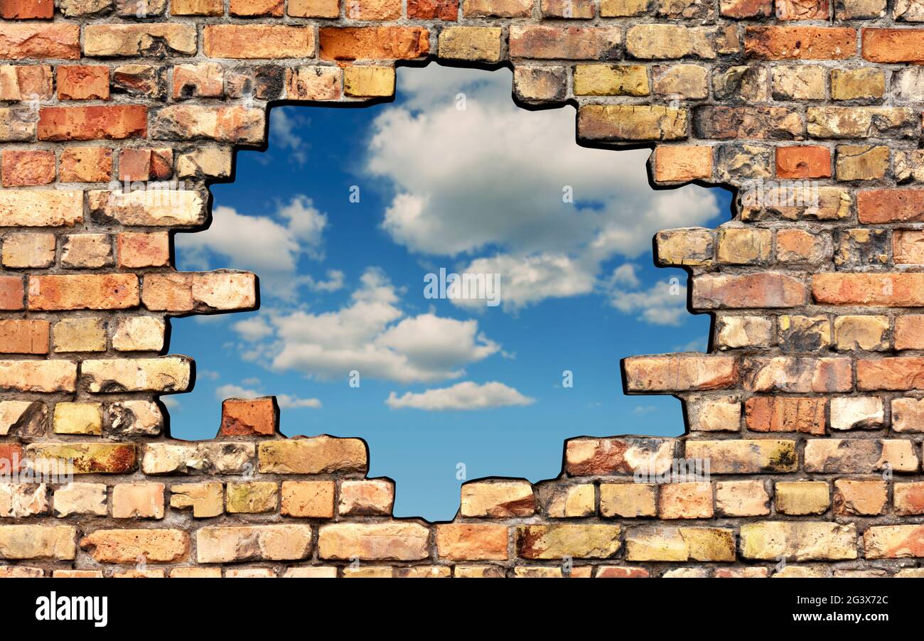 Freedom - hole in brick wall with cloudy sky in background Stock Photo ...