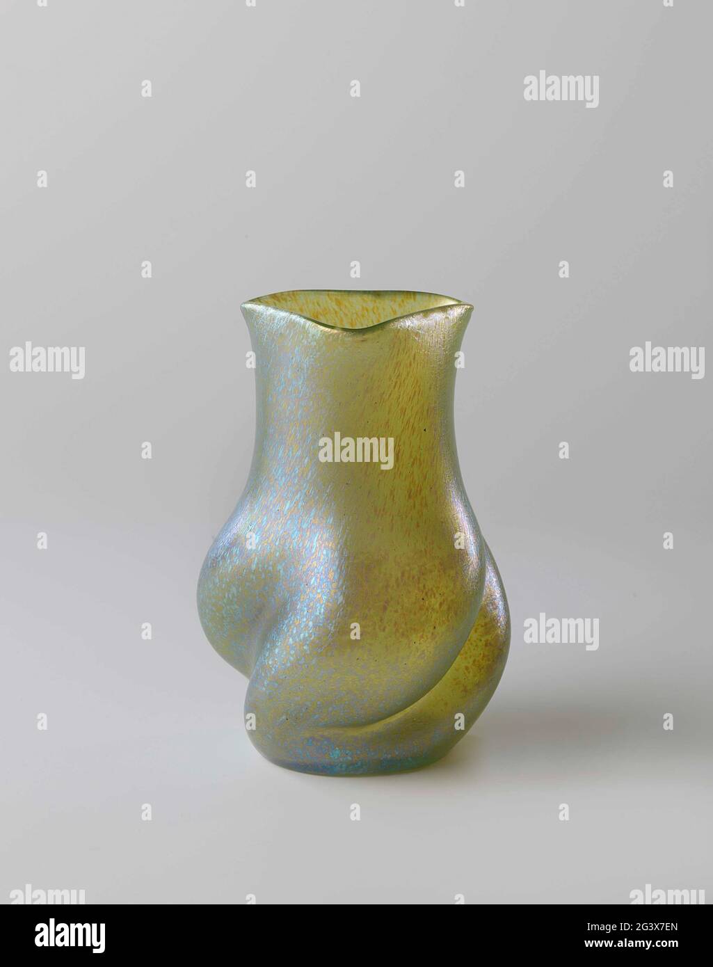 Vase with gusted green glass splinters and golden irisering. Flat soil ...