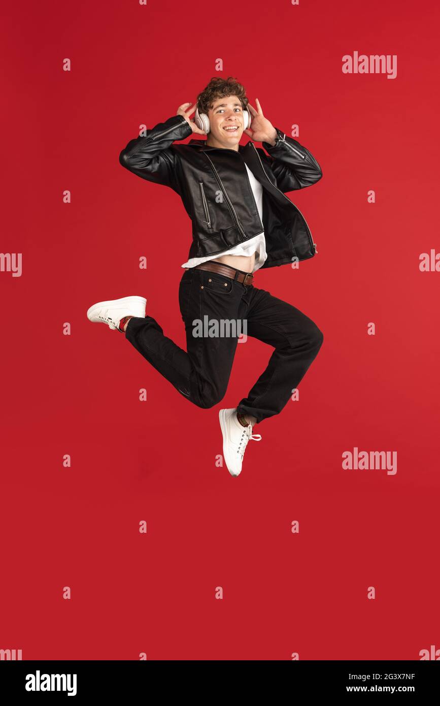 Male portrait isolated over red studio background with copyspace Stock ...