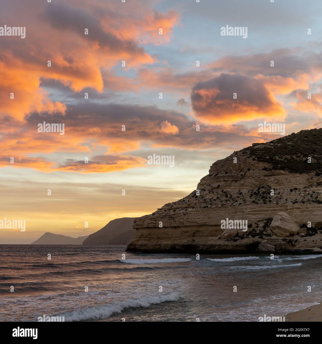 A beautiful ocean sunset on the Costa del Sol in Spain with beach and ...
