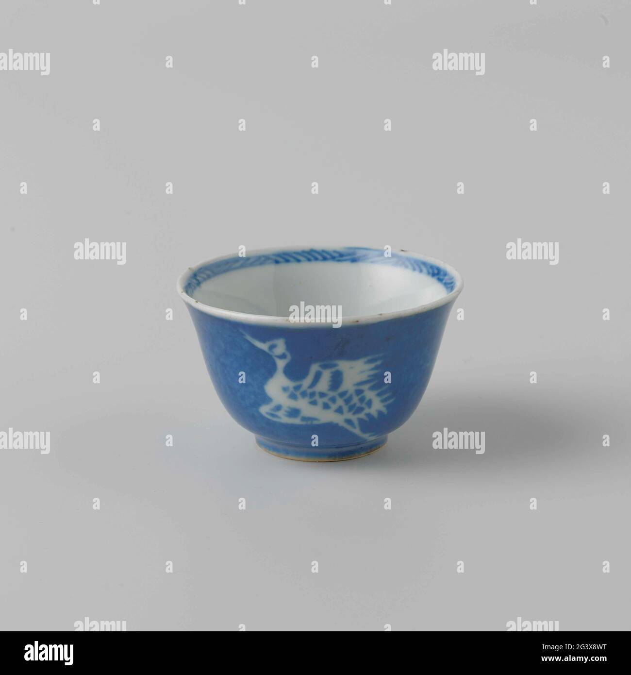 Cup with powder blue and cranes. Tea cup from porcelain, painted in ...