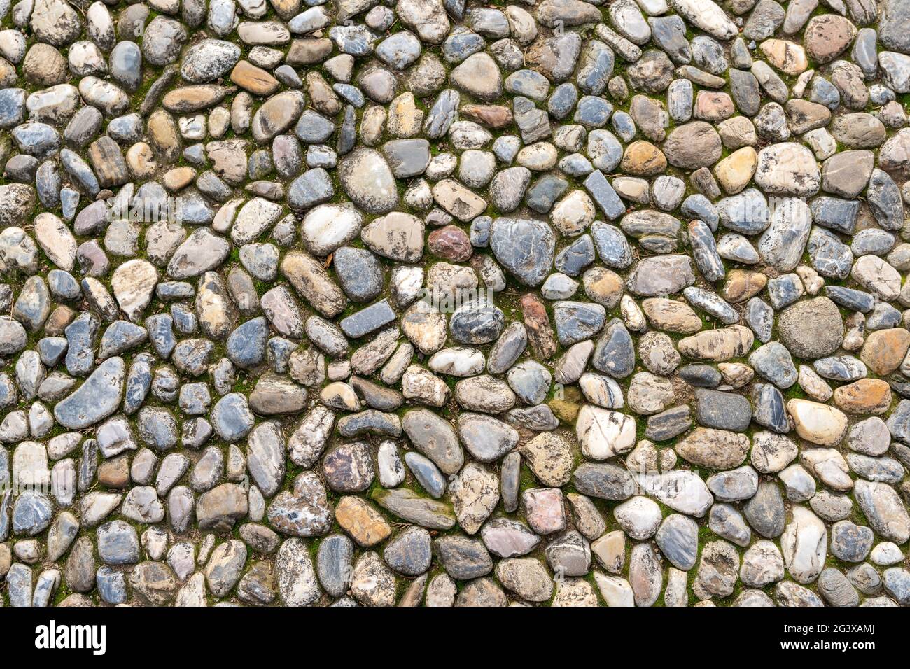 A top down view of packed pebble pavement background Stock Photo - Alamy