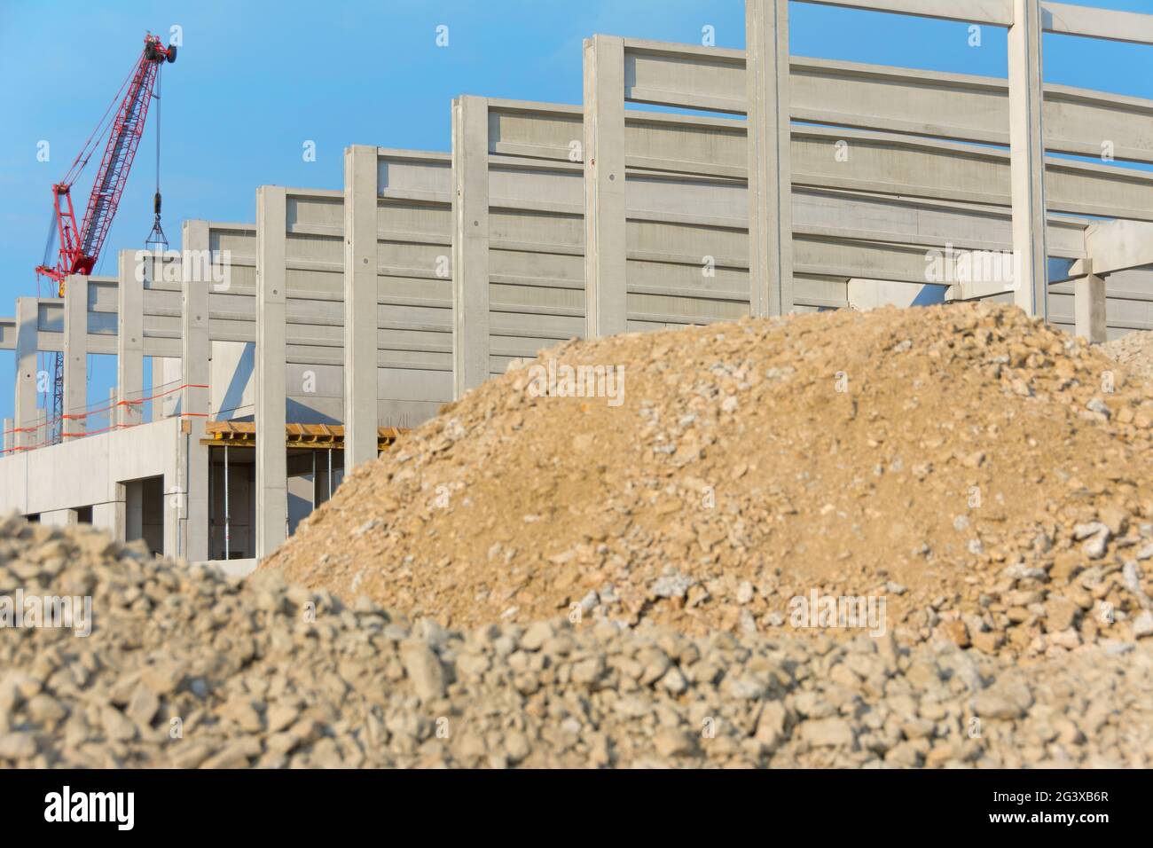 Construction site with crane, shell and building material Stock Photo ...