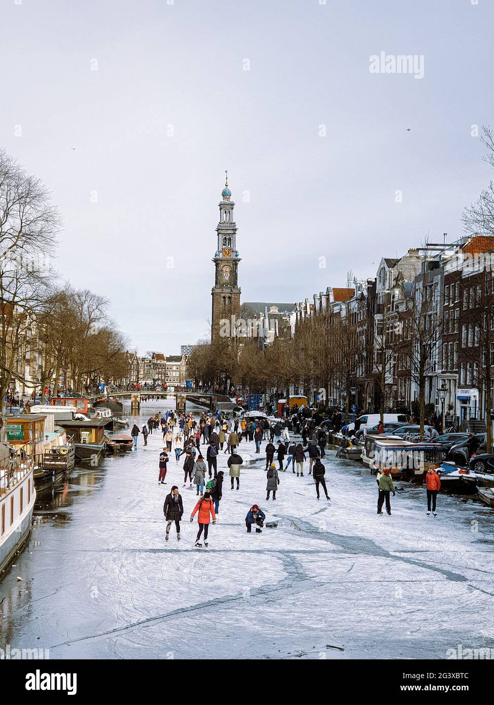 Amsterdam Netherlands, frozen canals and people ice skating in ...