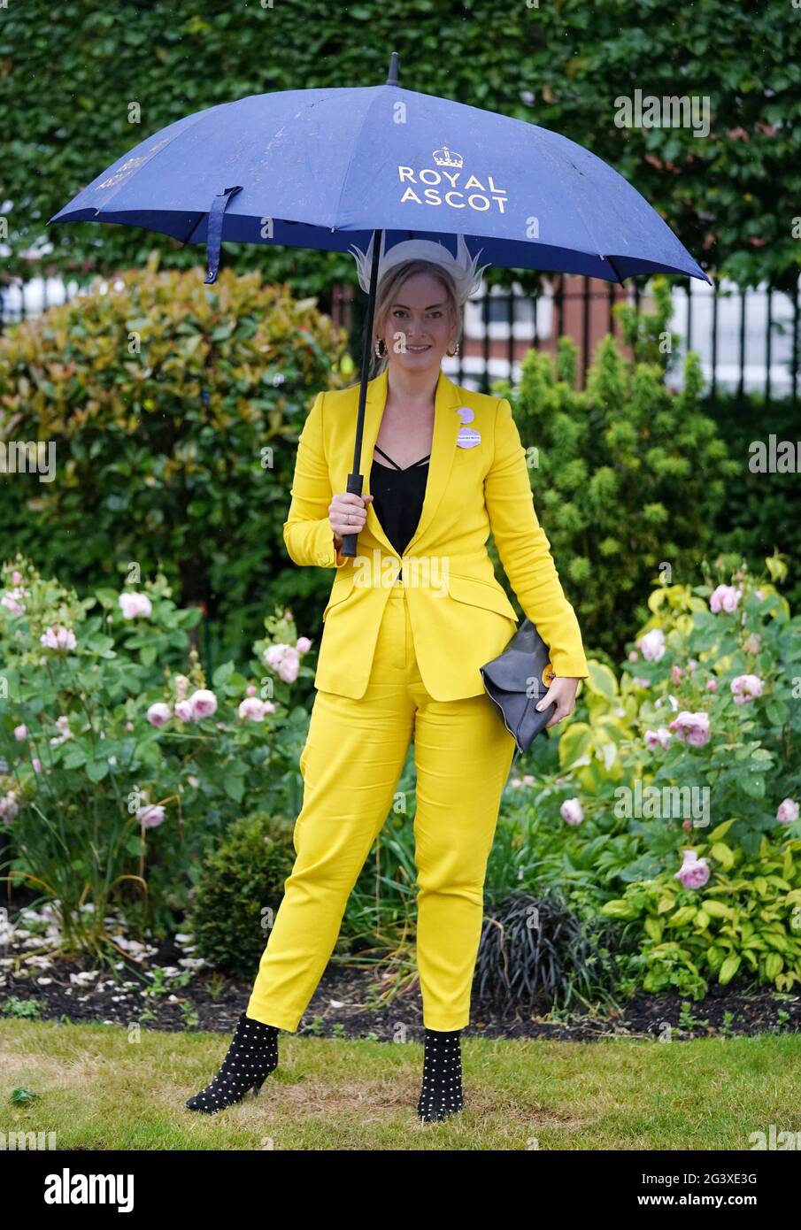 Alexandra Bertram shields under an umbrella during day four of Royal ...