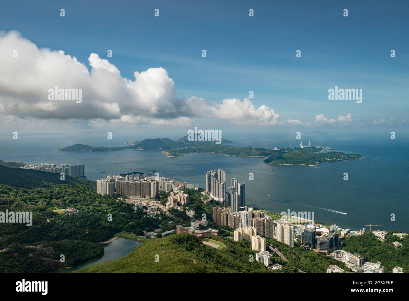 The high-rise residential towers of Pok Fu Lam on Hong Kong Island, the East Lamma Channel, and ...