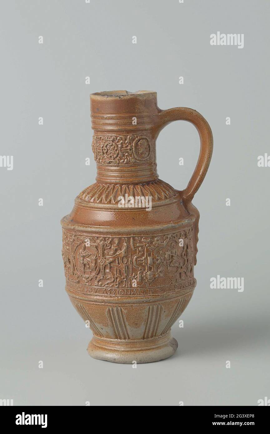 Jug. Brown jug of pottery. Belly with a straight-handed center piece on ...