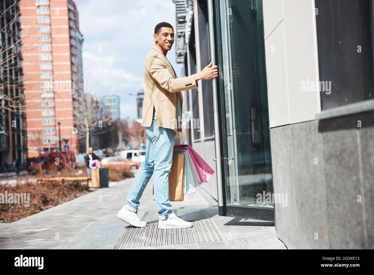 Man opening doors hi-res stock photography and images - Alamy