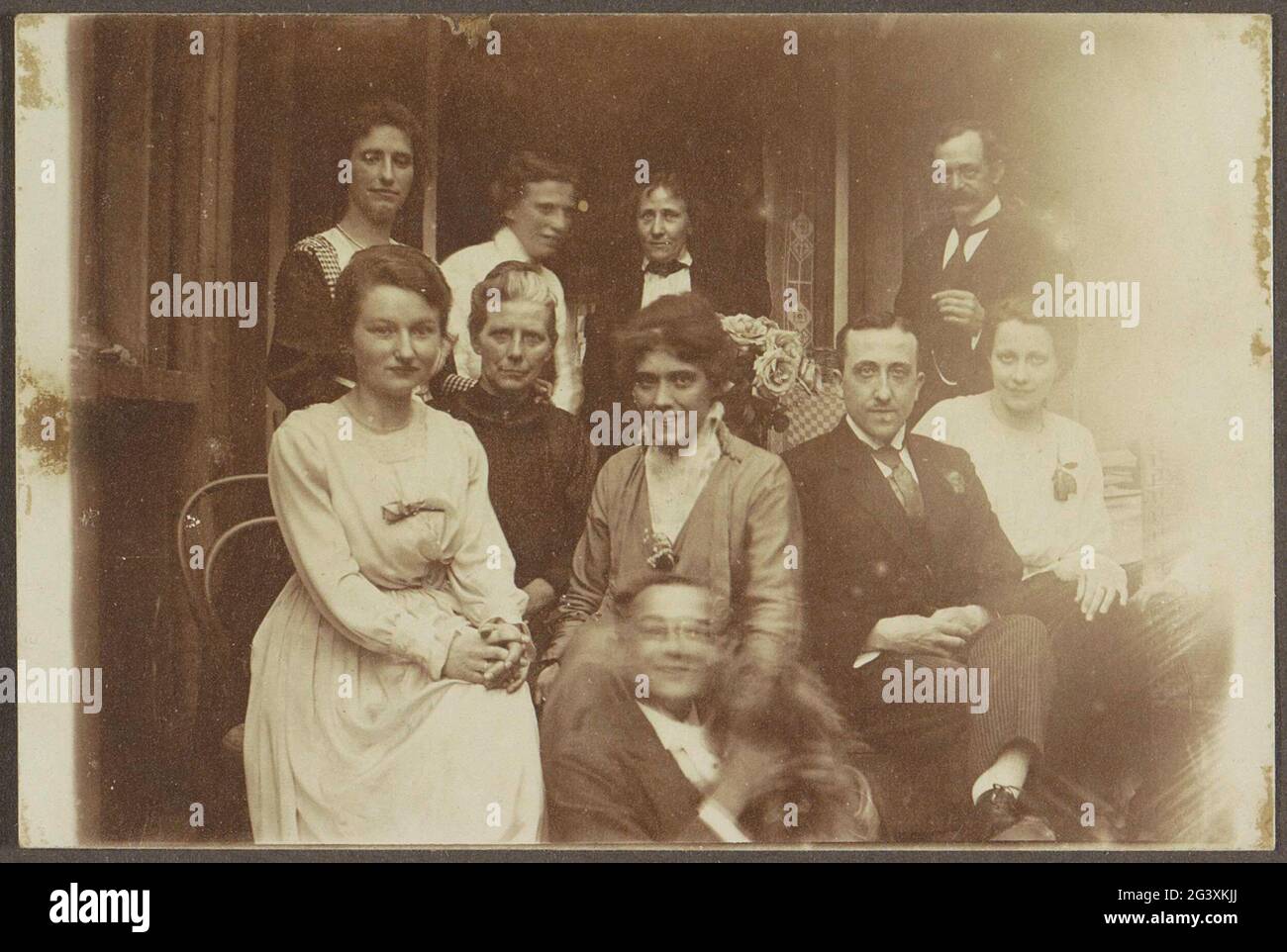 Group portrait of a group of men and women, presumably at a festive ...