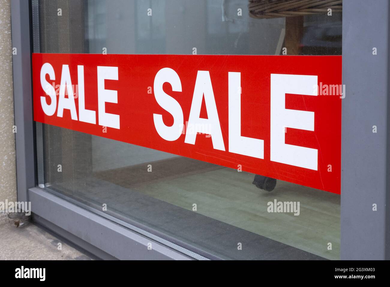 Shop window with sign sale Stock Photo - Alamy