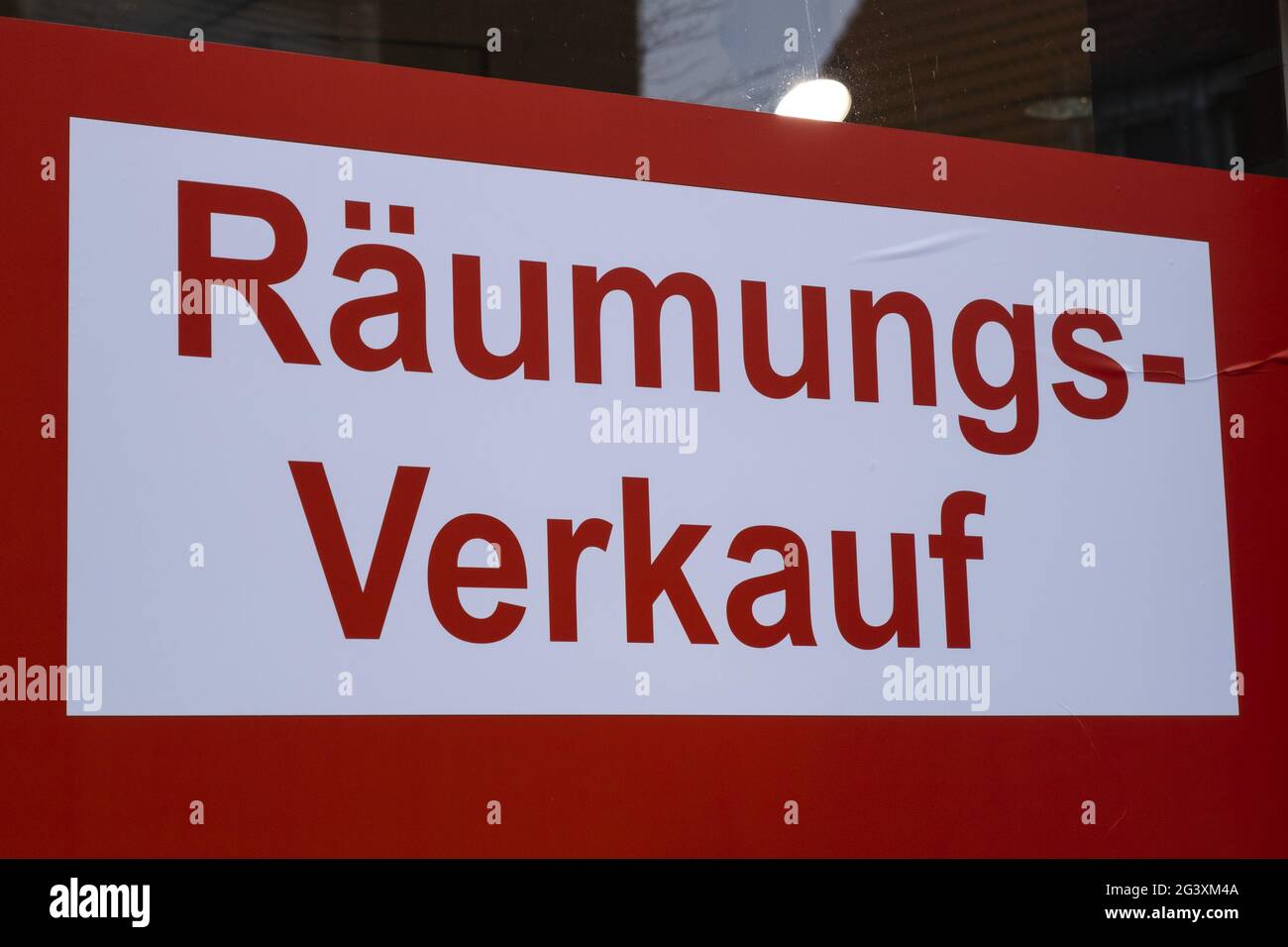 Shop window with sign clearance sale Stock Photo - Alamy