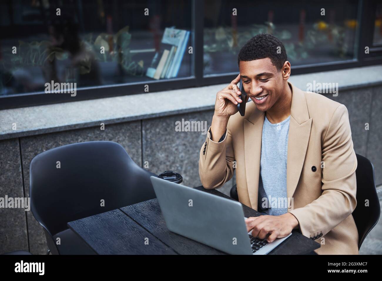 Positive delighted male person talking per telephone Stock Photo - Alamy