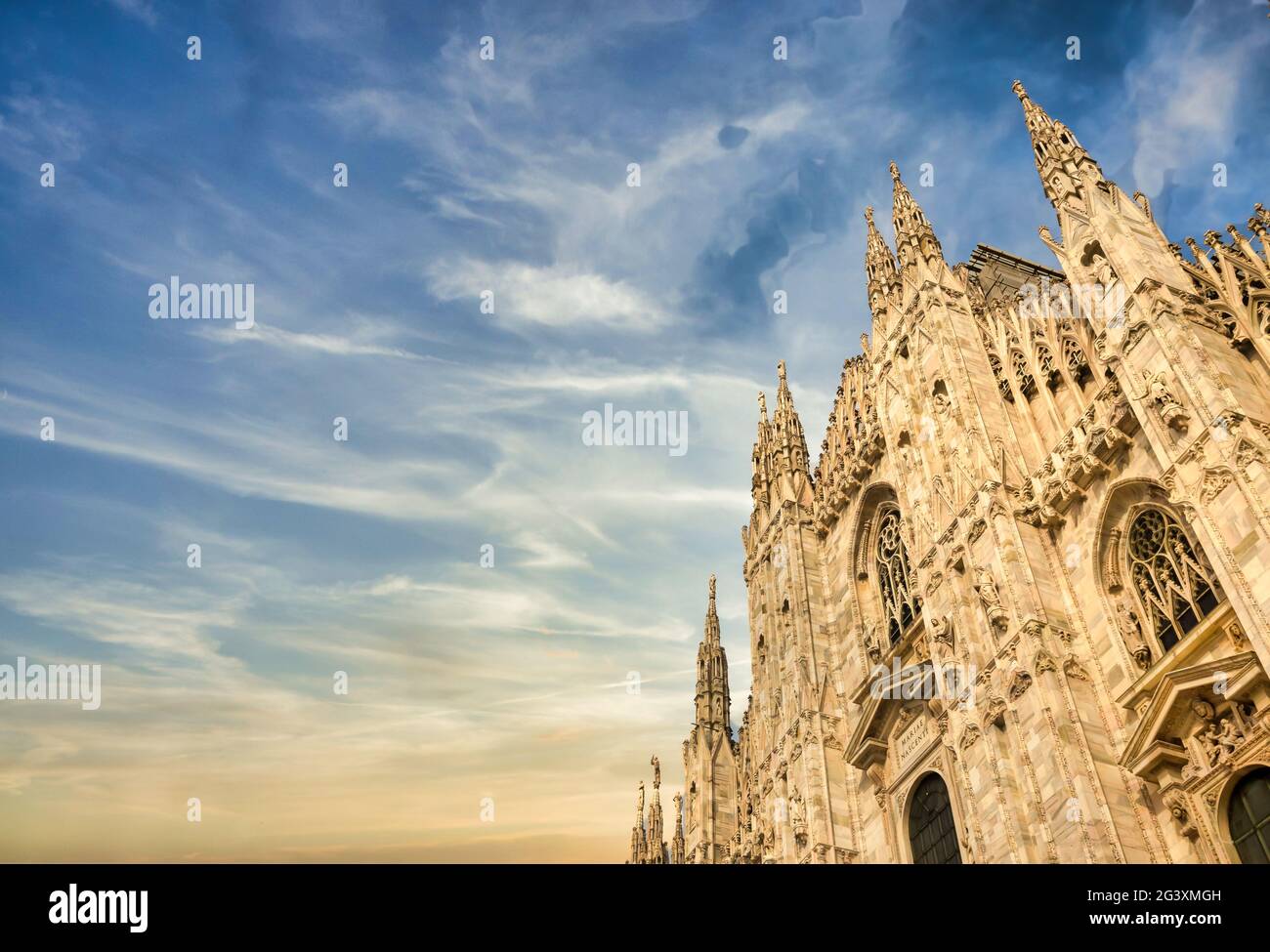 Milan Cathedral (Duomo di Milano) with blue sky and sunset light Stock ...