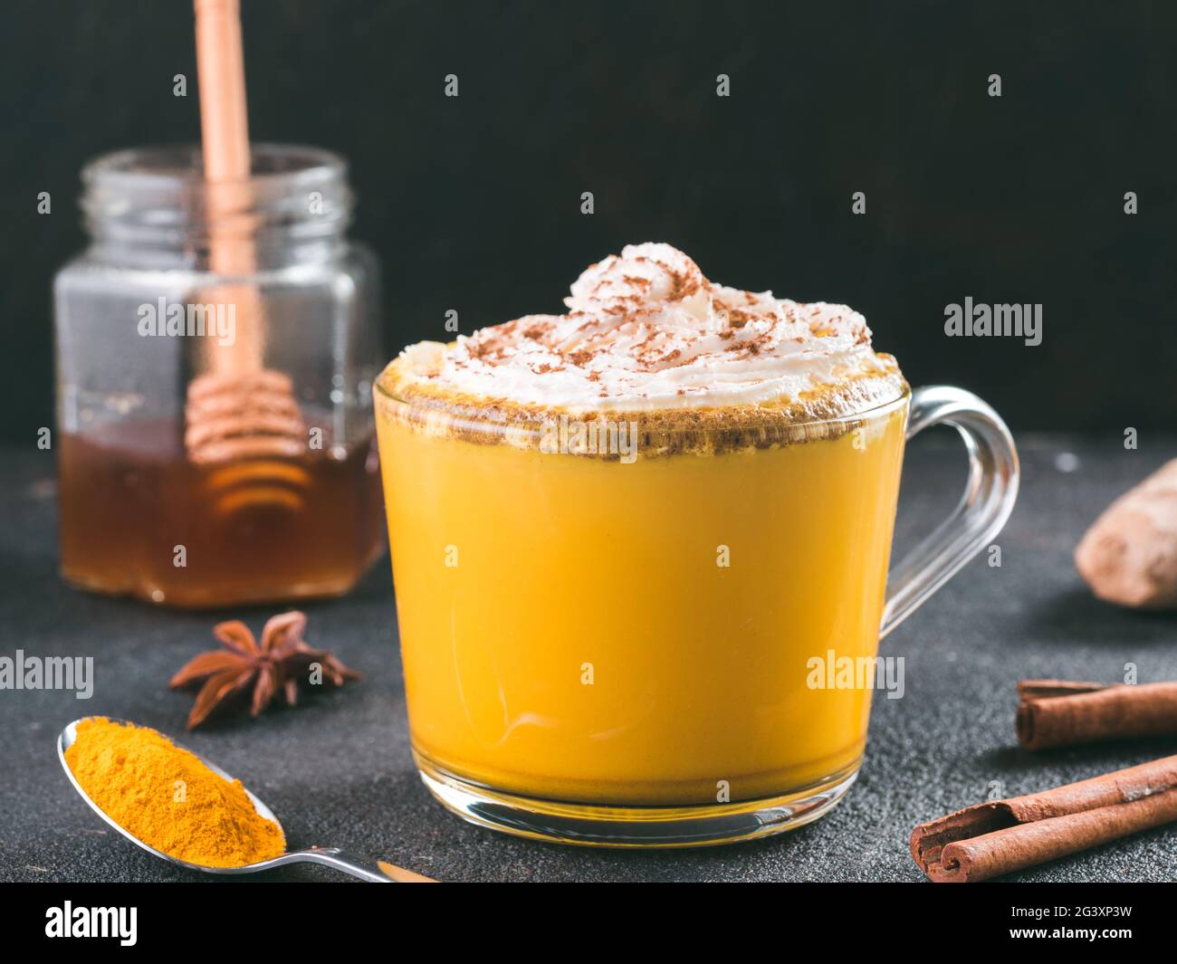 Golden turmeric latte and ingredients, copy space Stock Photo - Alamy