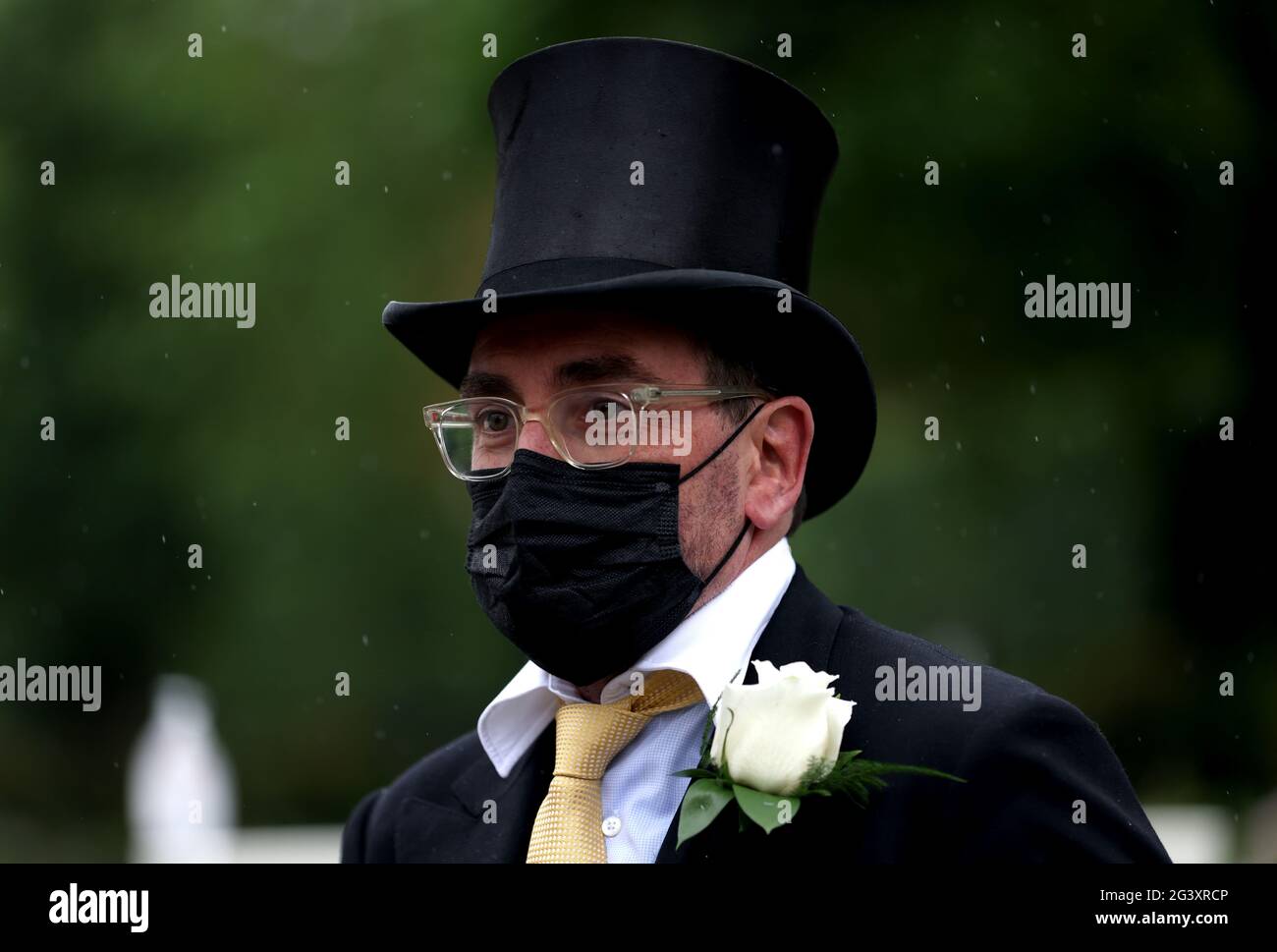 Racegoers wear face masks as they arrive for day four of Royal Ascot at ...