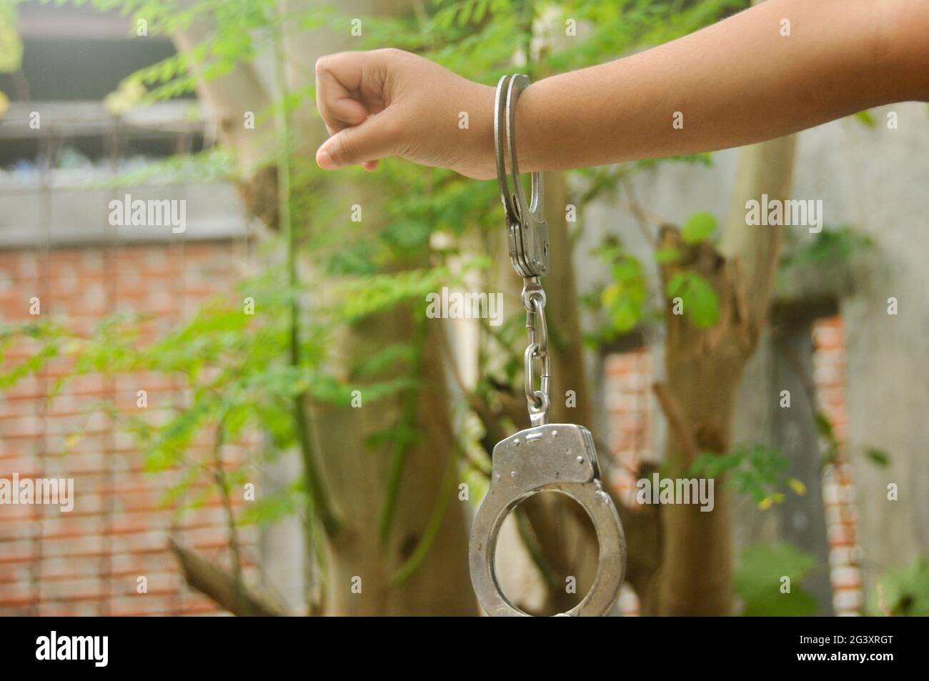 Locked handcuff as illustration Stock Photo - Alamy