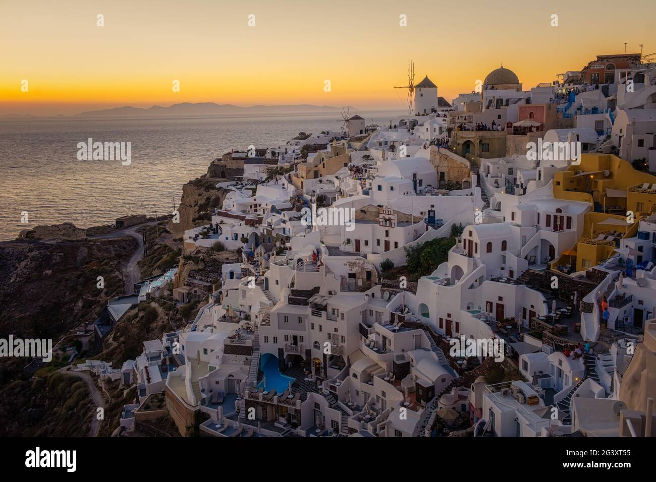 Oia village Santorini with blue domes and whitewashed house during ...