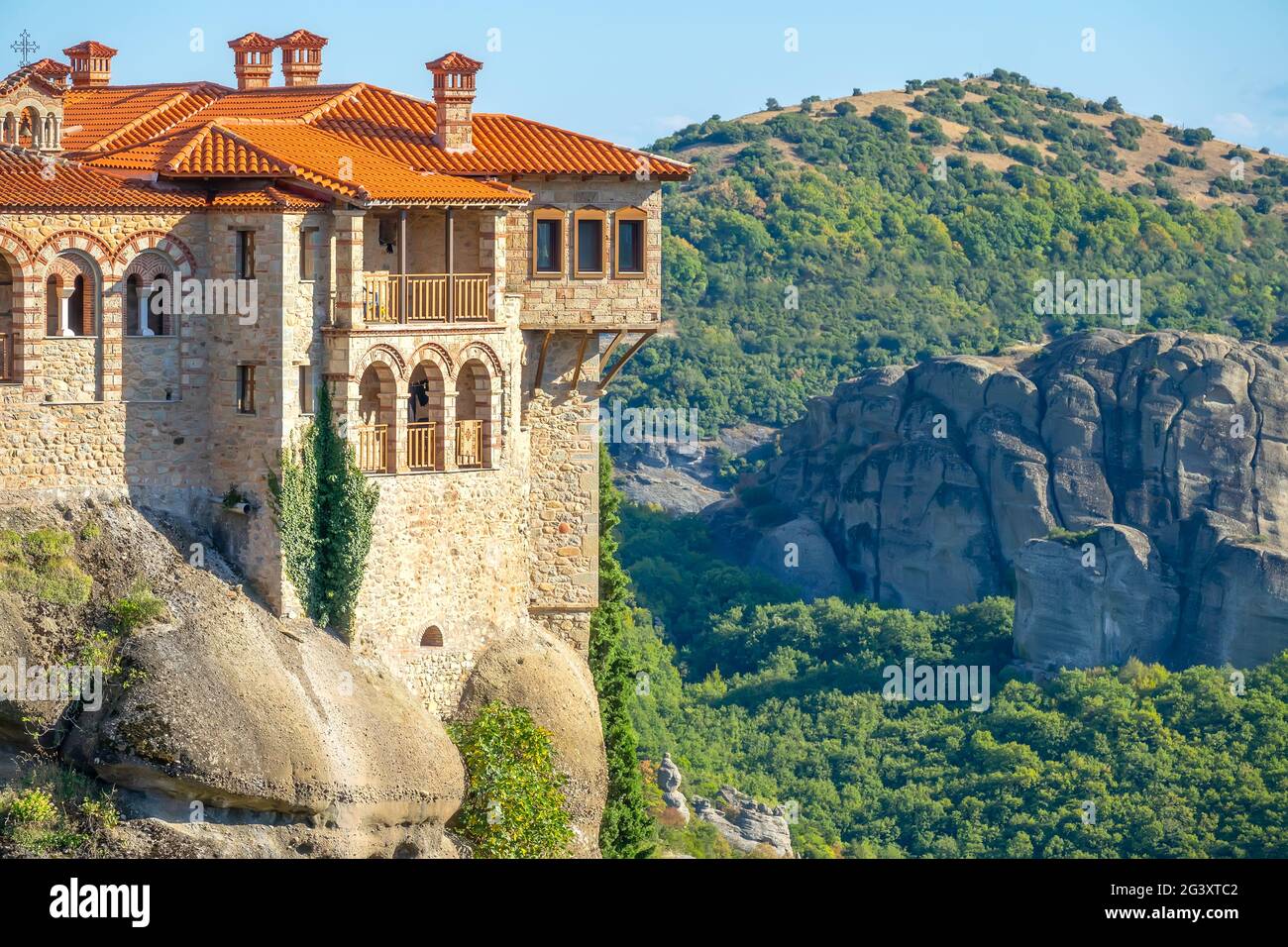 Sunny Summer Day and Balconies of a Rocky Monastery Stock Photo - Alamy