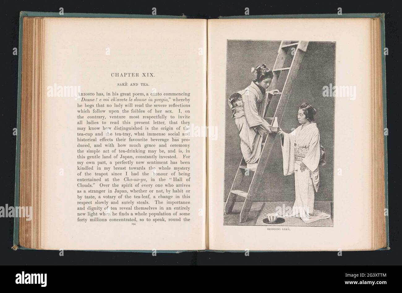Two Japanese women whose one is on a ladder with a bottle of sake in ...