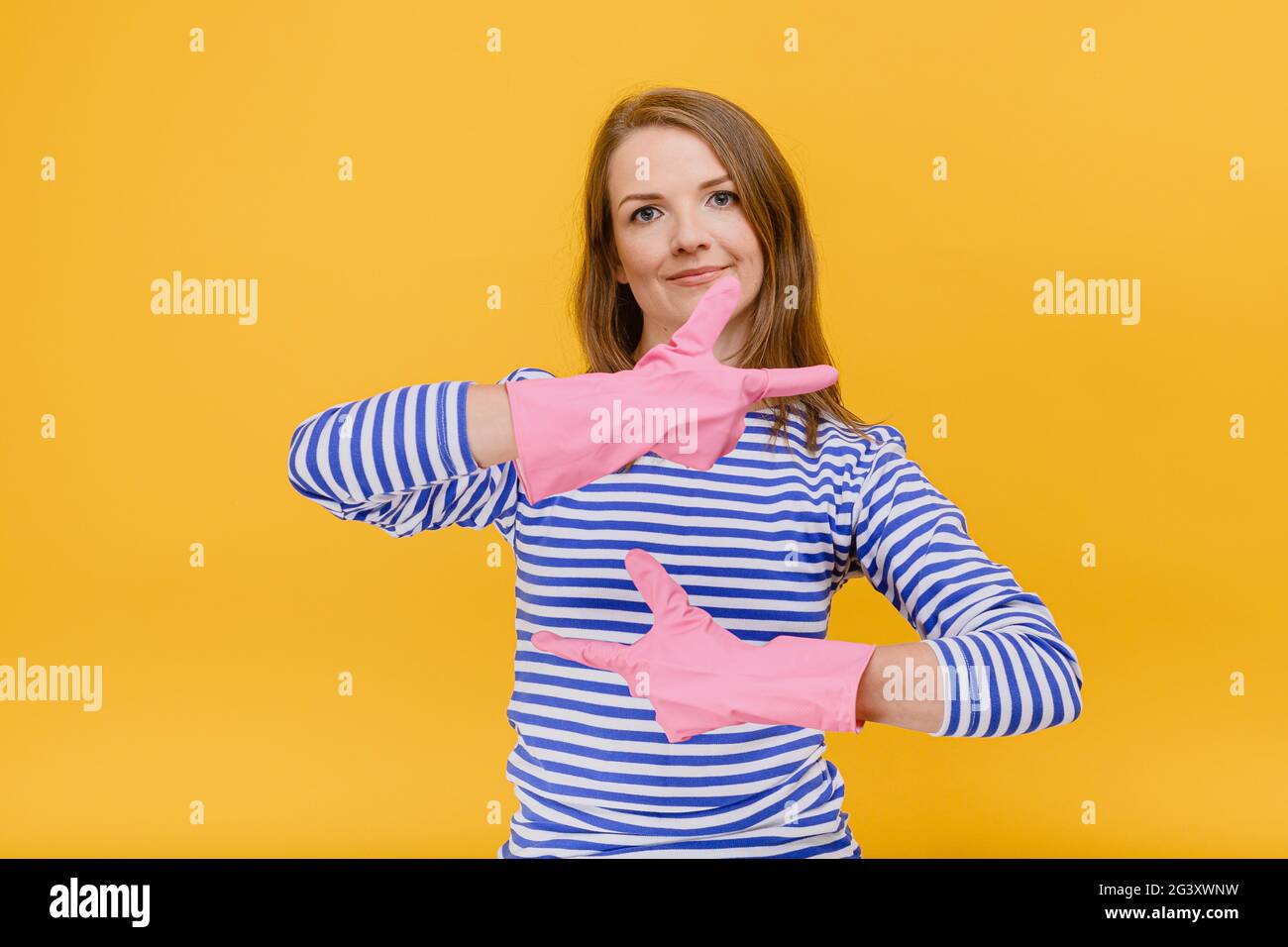Brown haired female points at different sides in rubber protective ...
