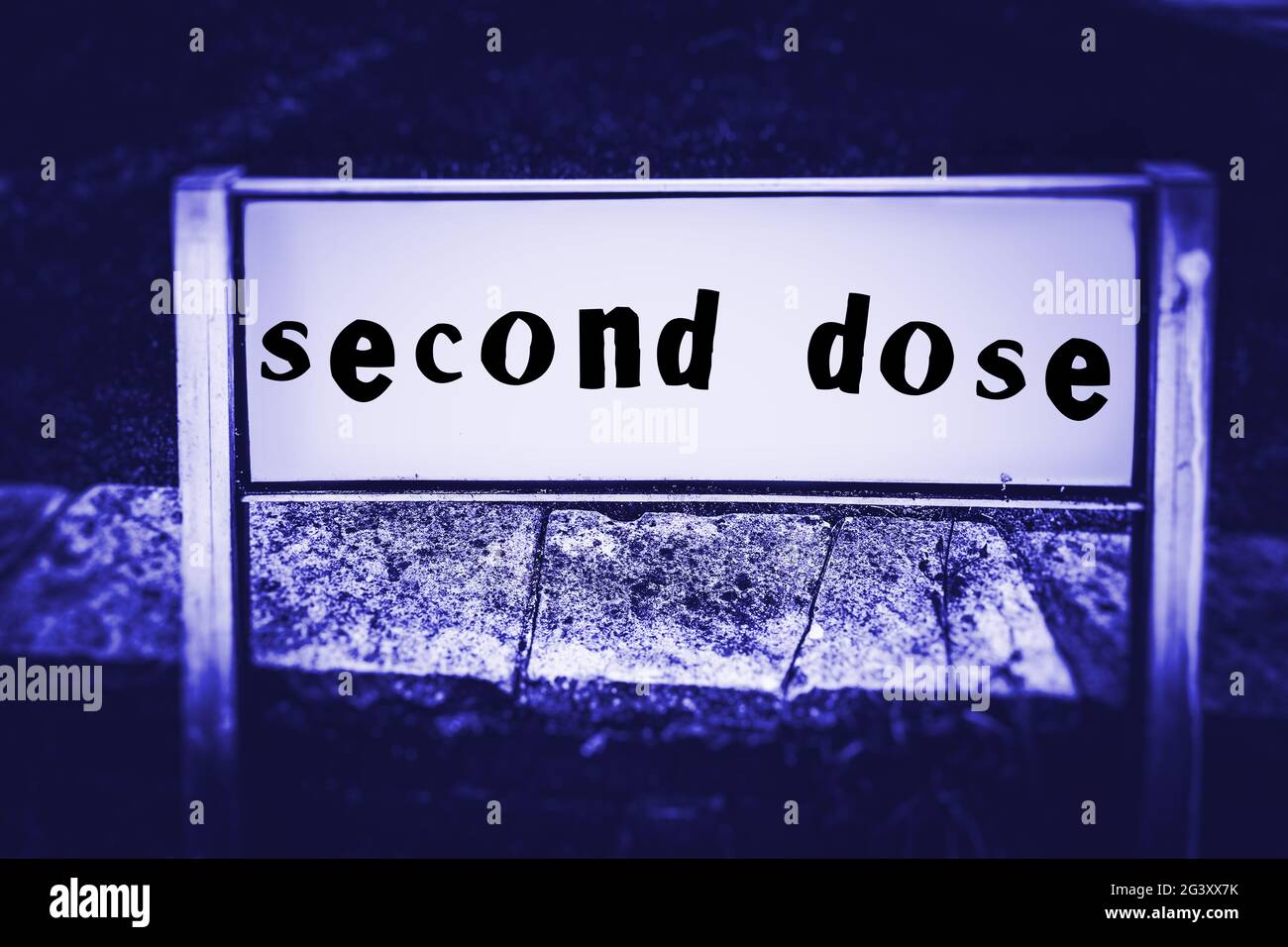 Second Dose displayed on a road sign with a blue tone Stock Photo - Alamy