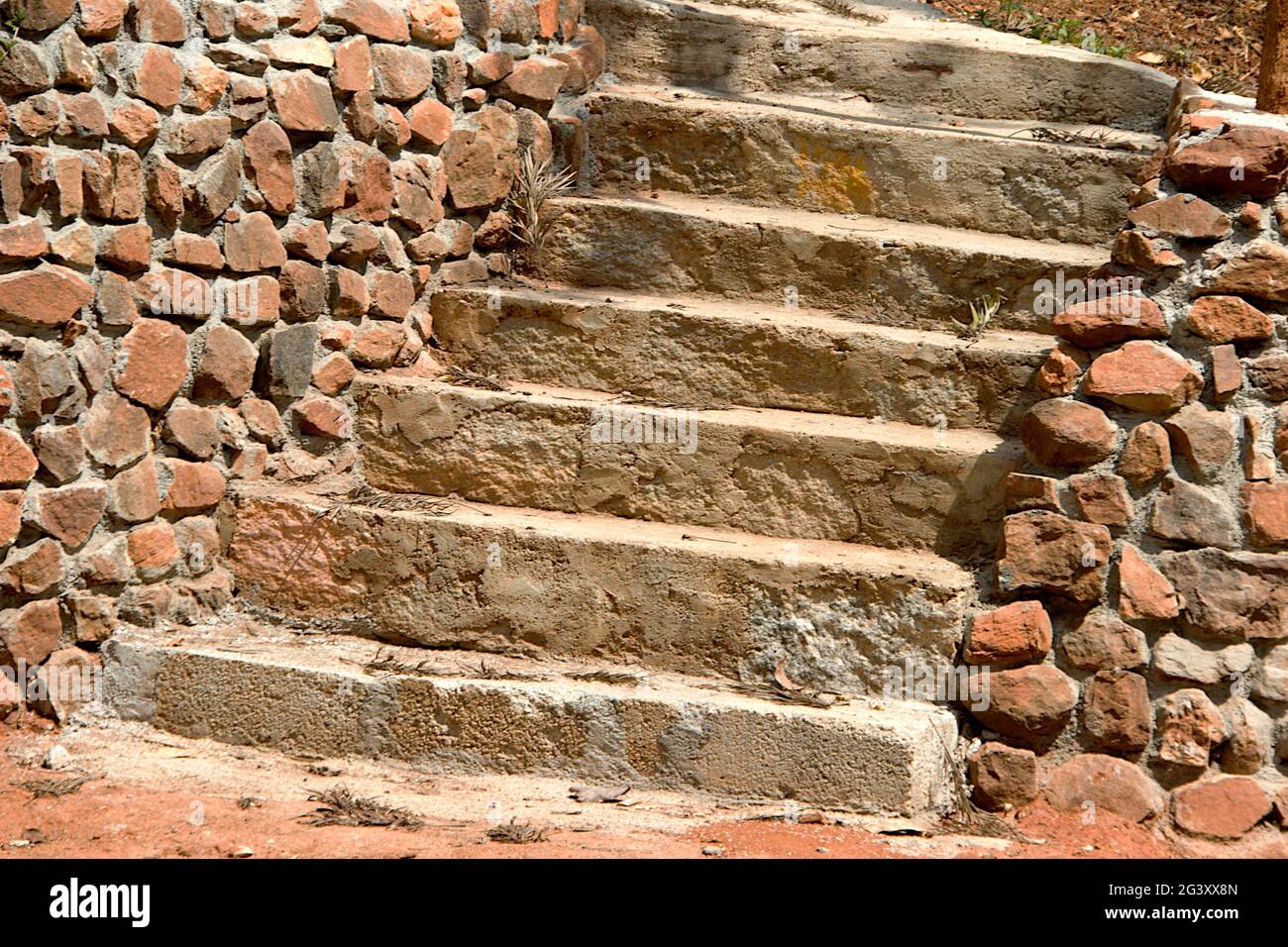 Steps between Rubble Walls Stock Photo - Alamy