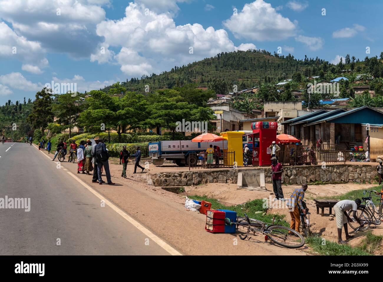 People run along roadside, near Mudasomwa, Southern Province, Rwanda ...