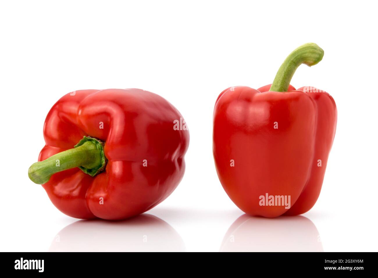 Two red bell peppers isolated on white Stock Photo - Alamy