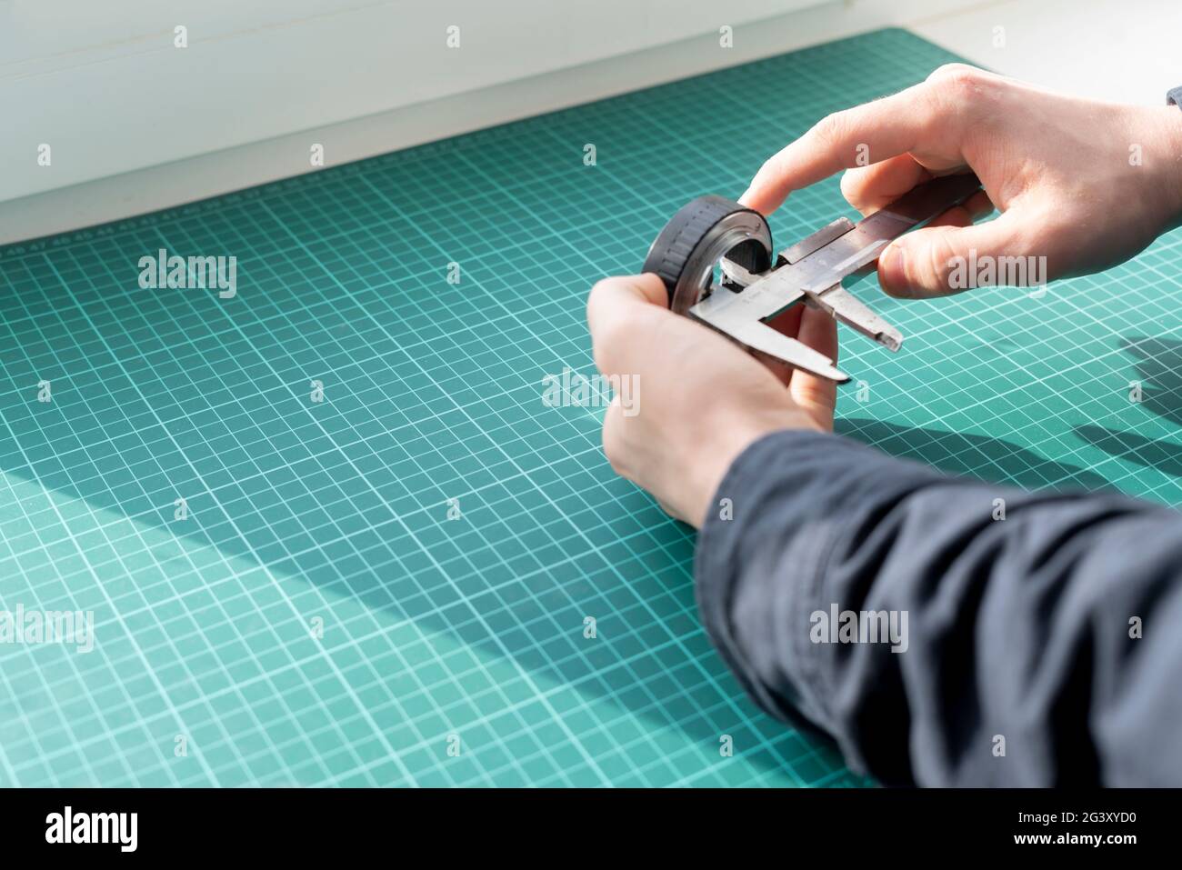 engineer hand working and measure the parts with caliper tool Stock ...