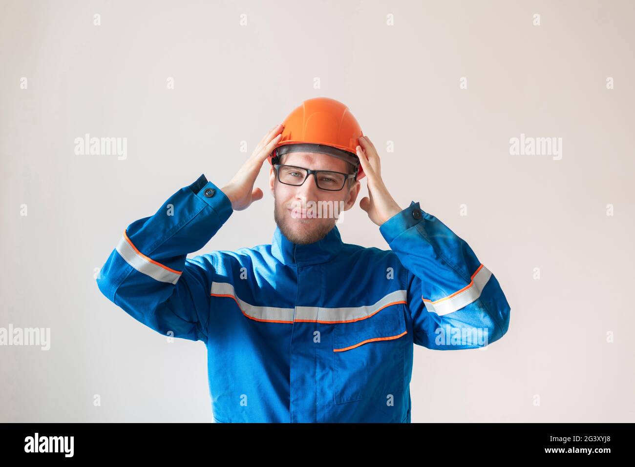 young male worker holding a helmet, industrial safety equipment Stock ...