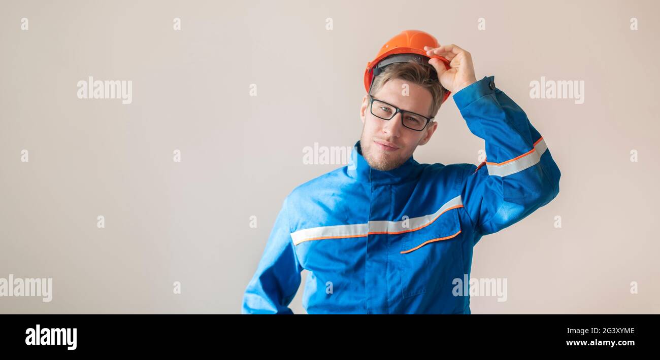 young male worker holding a helmet, industrial safety equipment Stock ...