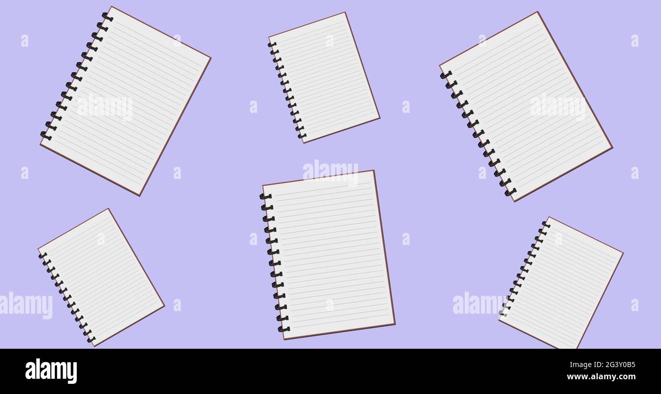 Composition of spiral bound notebooks floating over lilac background ...