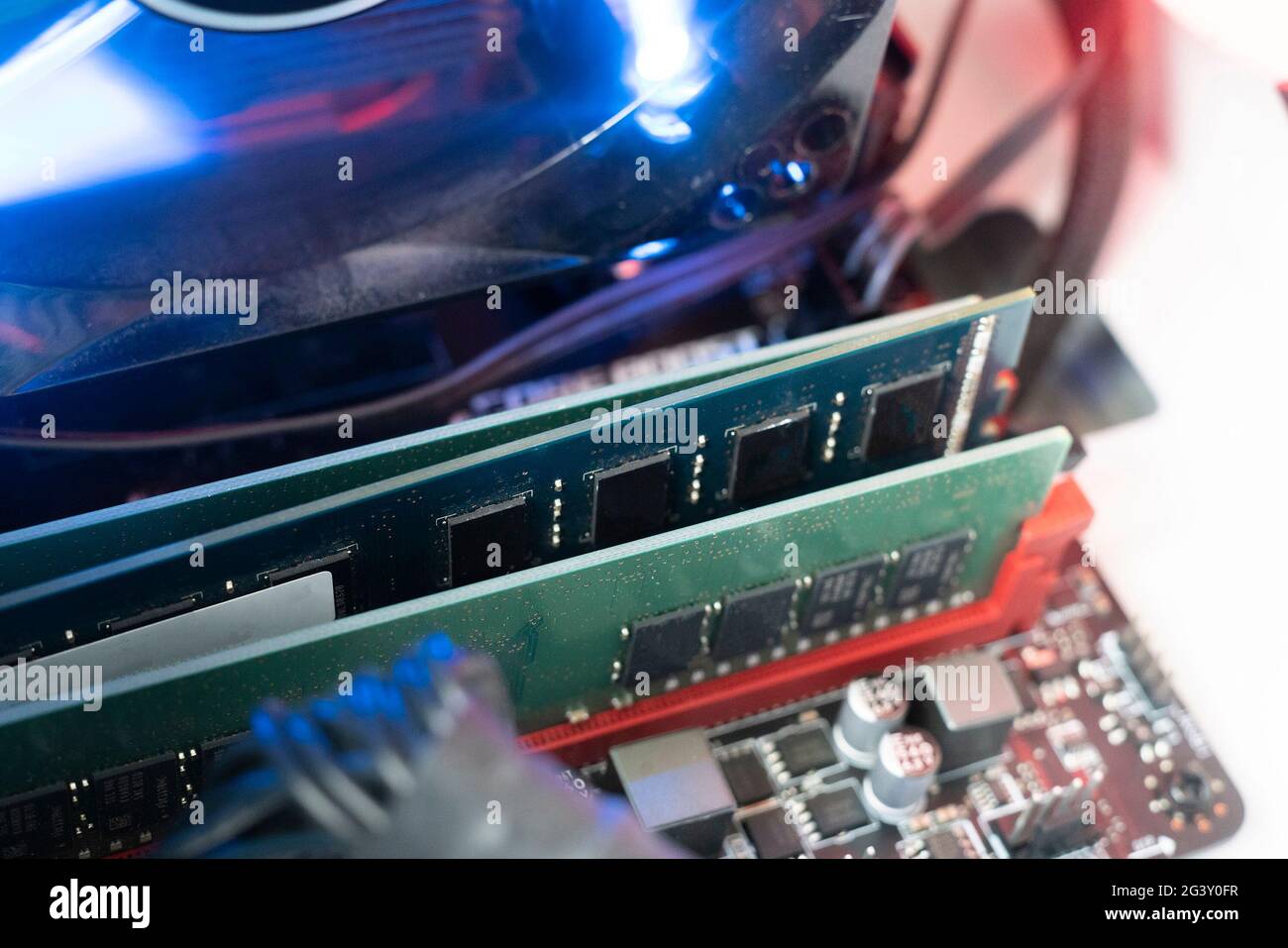 inserting plug in the ram ddr memory card in the computer mainboard ...