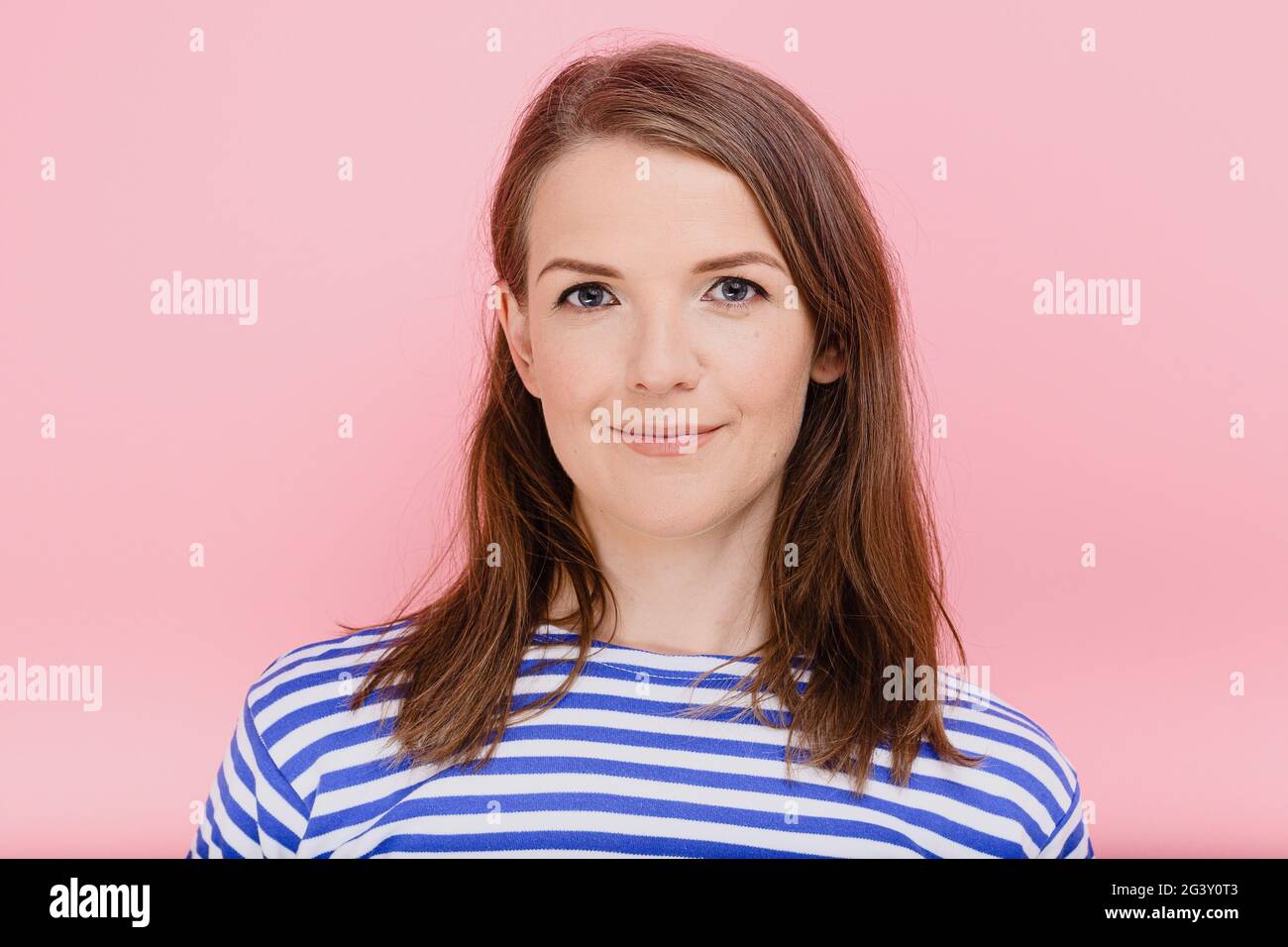 Pleasant looking caucasian woman smiles gently has charming smile ...