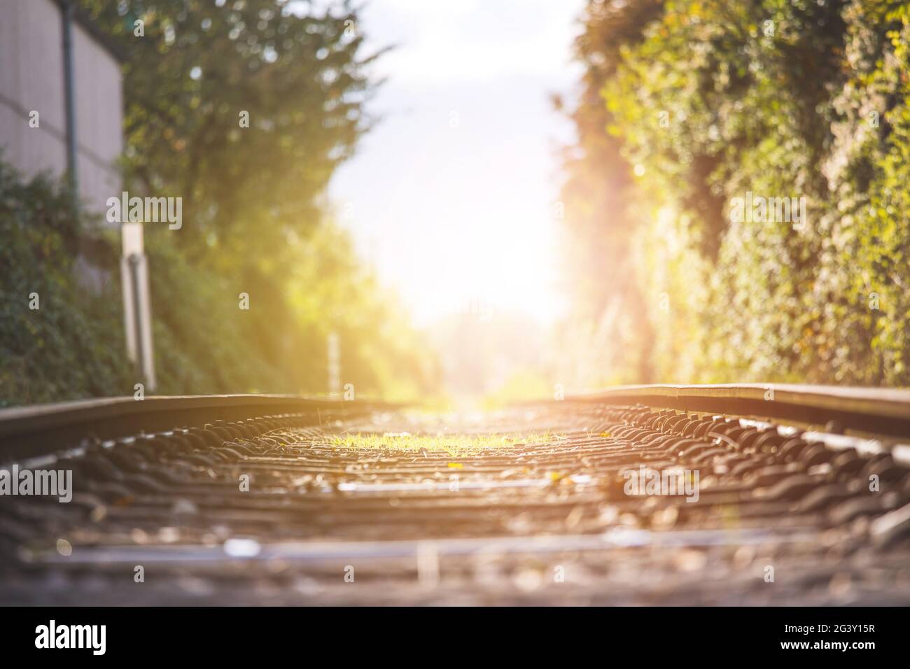 Sustainable traveling by train: Rail track and colorful, idyllic ...