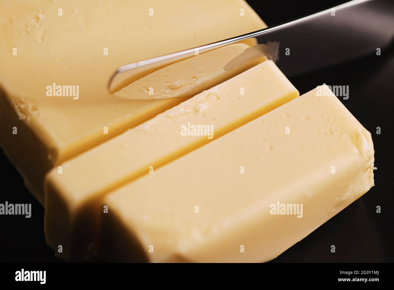 Sliced organic butter block and knife, breakfast food Stock Photo - Alamy