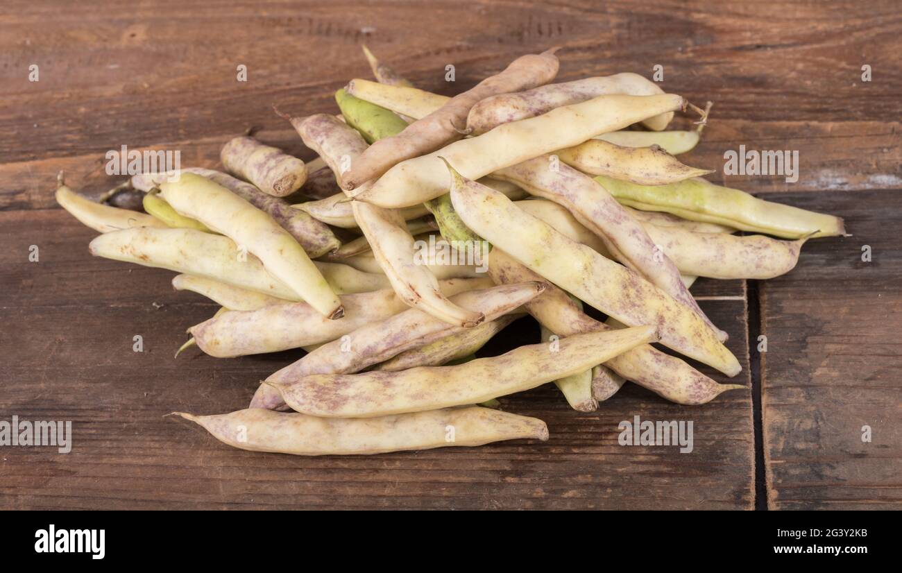 Coco beans on wooden background Stock Photo - Alamy